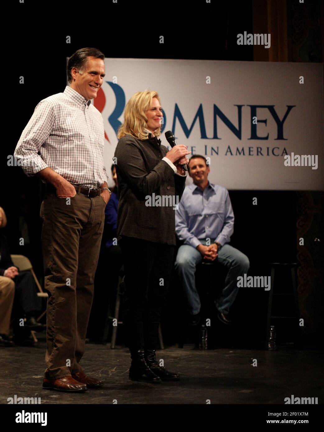 Republican presidential candidate Mitt Romney waits to speak while his ...