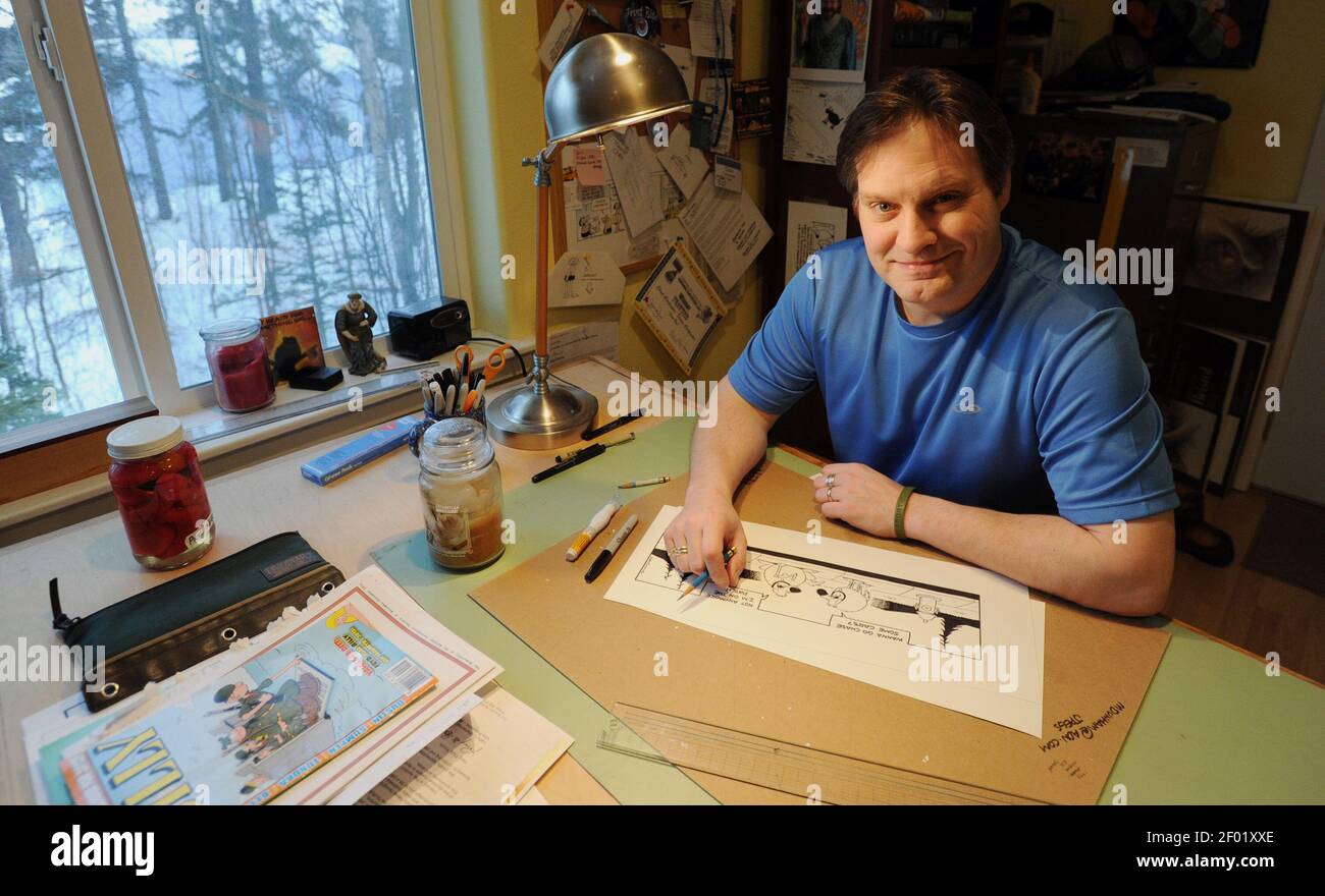 Chad Carpenter draws his "Tundra" cartoon in his studio at his home in ...