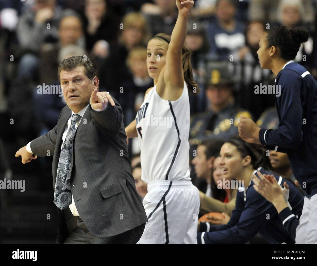 Connecticut head coach Geno Auriemma and Caroline Doty make the call as ...