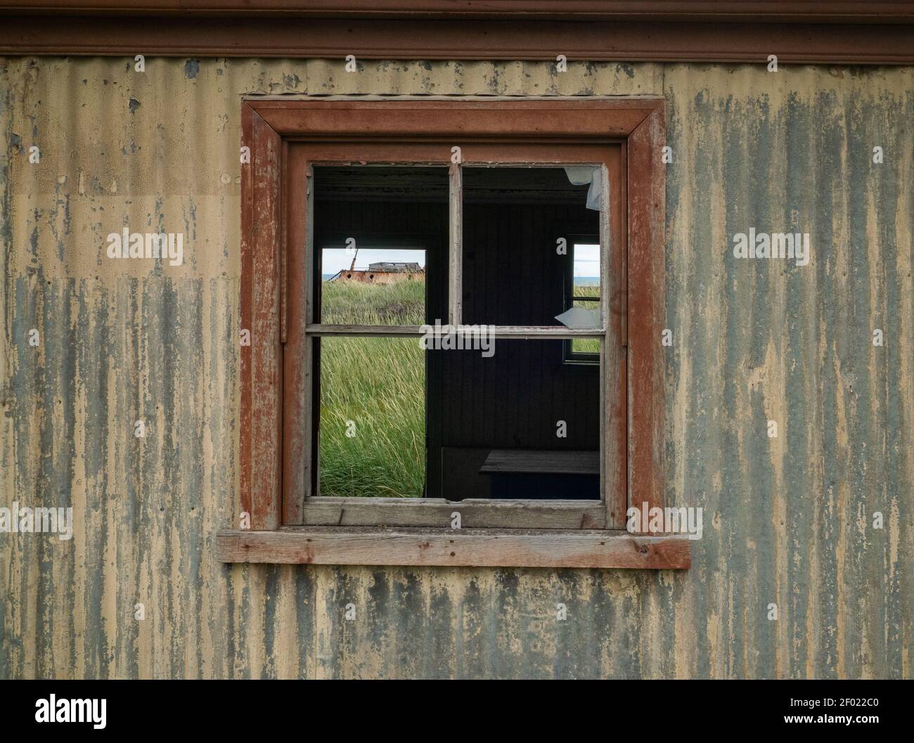 View through the window of a dilapidated shack on the dramatic ...