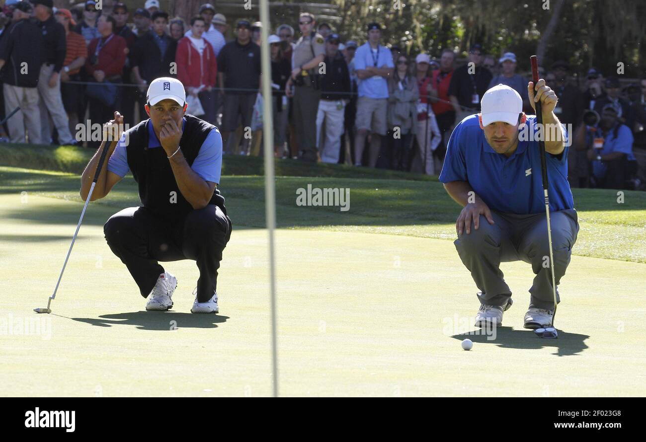 Tiger Woods, left, and the Dallas Cowboys' Tony Romo line up their ...