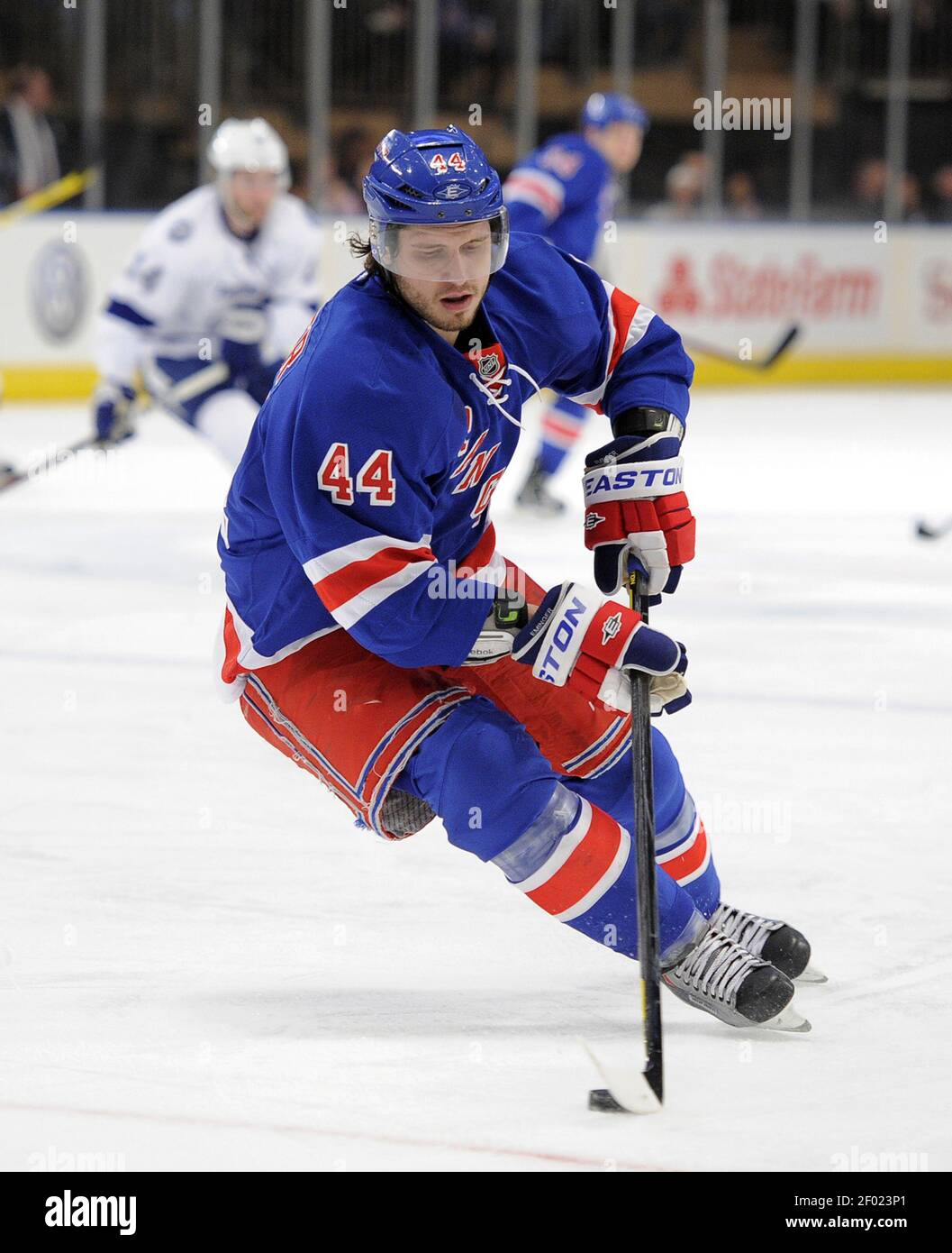 Steve Eminger of the New York Rangers moves the puck during the first ...