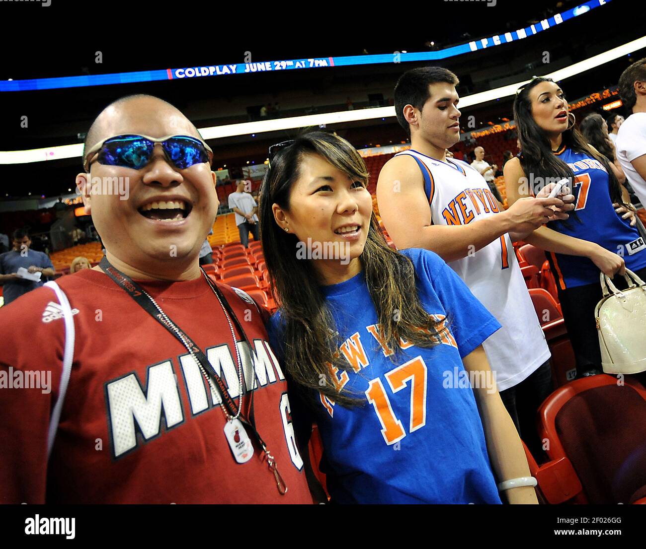 Jon Eng proudly wears his LeBron James jersey alongside his wife, Alice ...