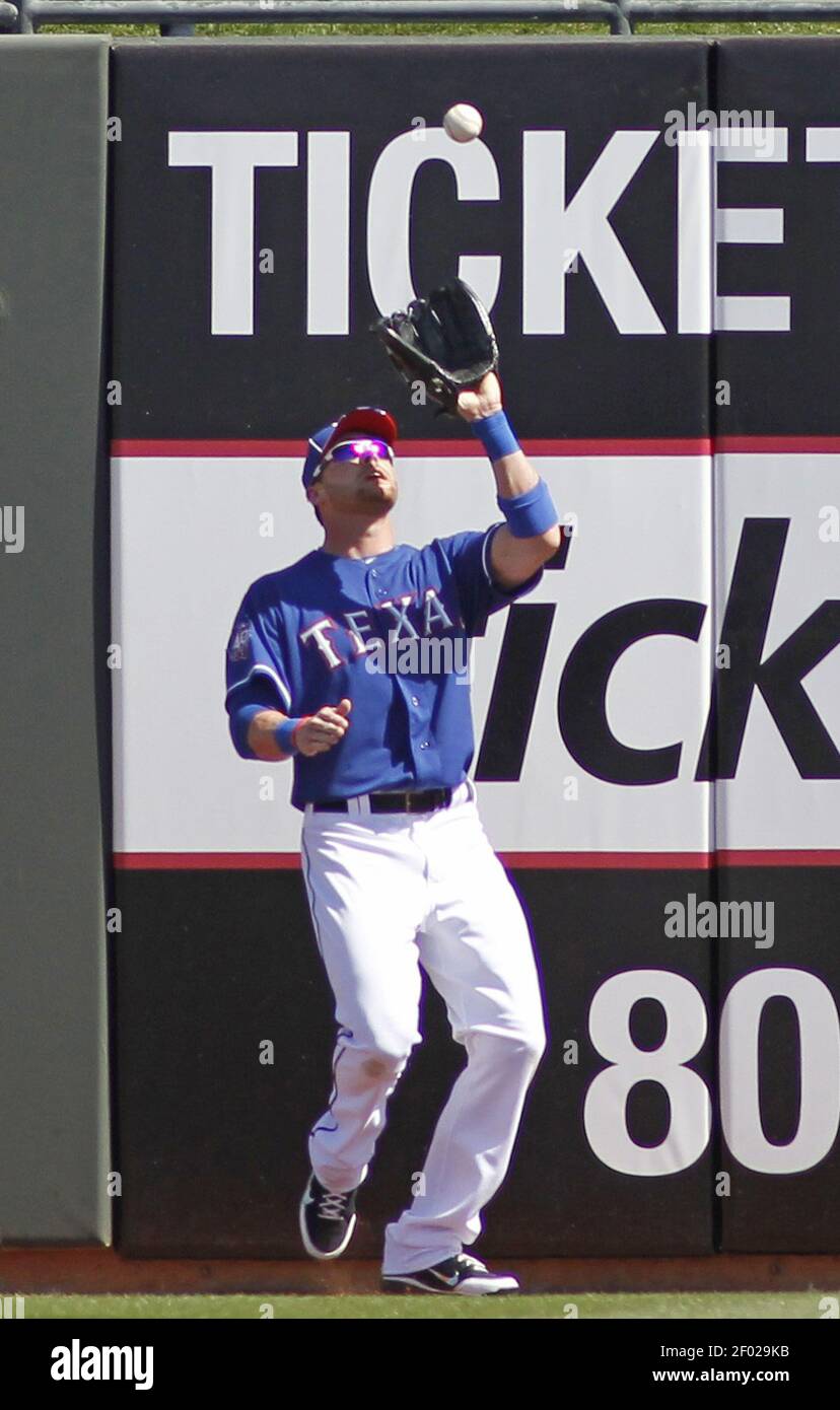 Texas Rangers center fielder Craig Gentry (23) fields a hit to center ...