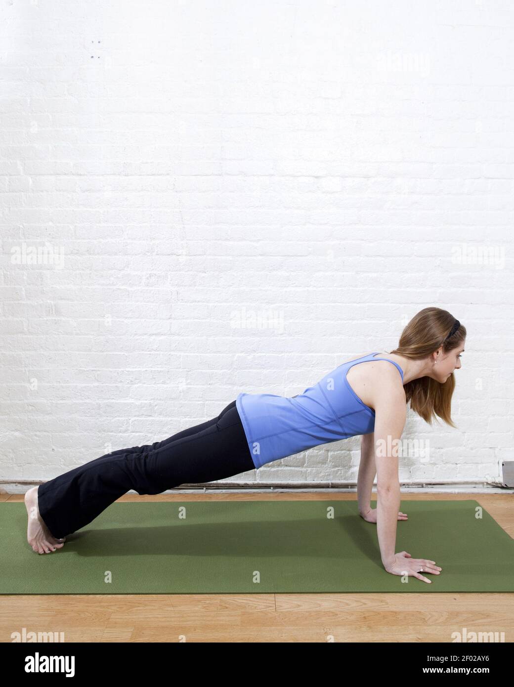 Bridget Casey, an instructor at Real Pilates in New York City, does a ...