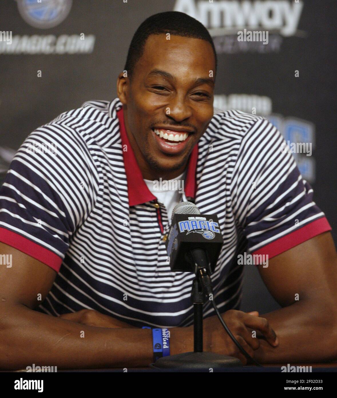Orlando Magic center Dwight Howard breaks into a smile during a news ...