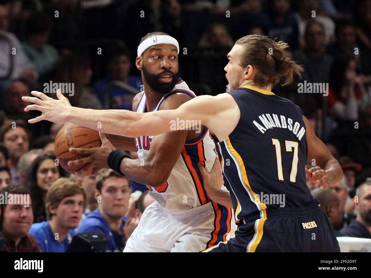 Baron Davis of the New York Knicks controls the ball against Louis ...