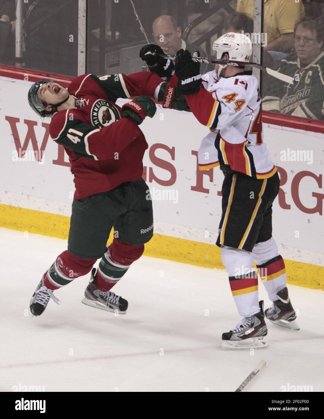 The Calgary Flames' Chris Butler, right, draws a high-sticking penalty ...