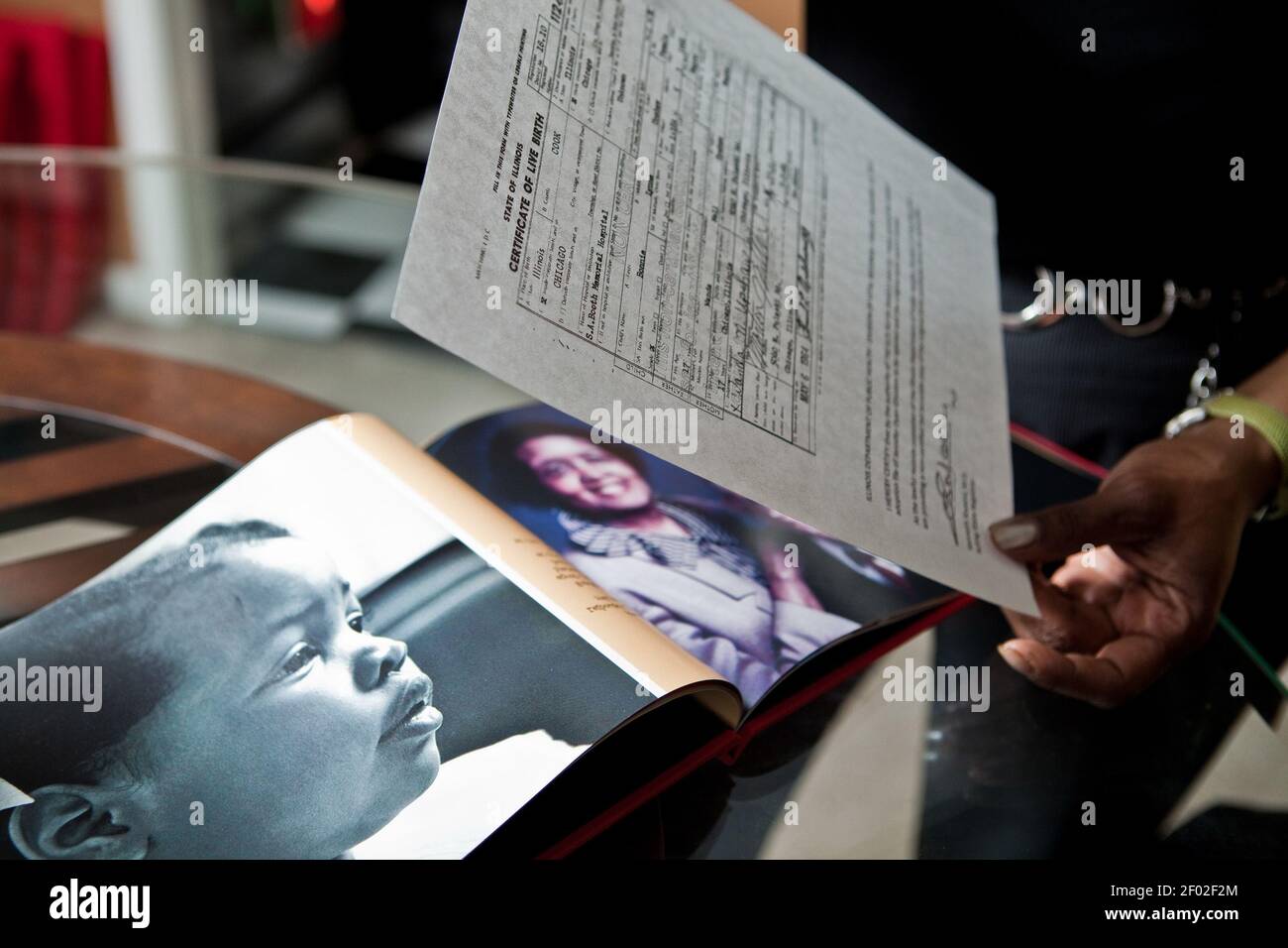 Jennifer Dyan Ghoston, 47, holds her birth certificate during visit of ...