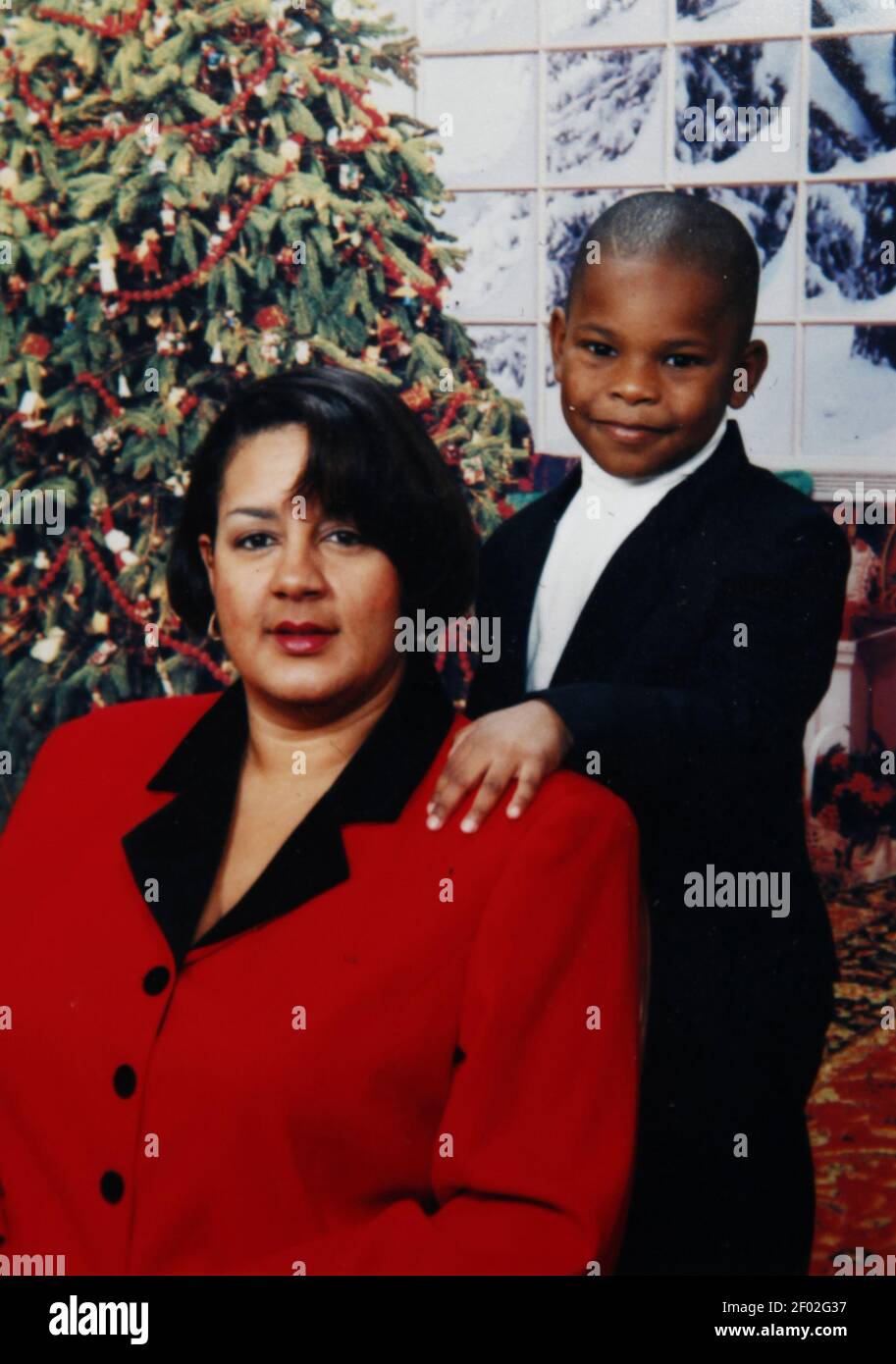 Five-year-old Joshua Travis appears with his adoptive mother Maria ...