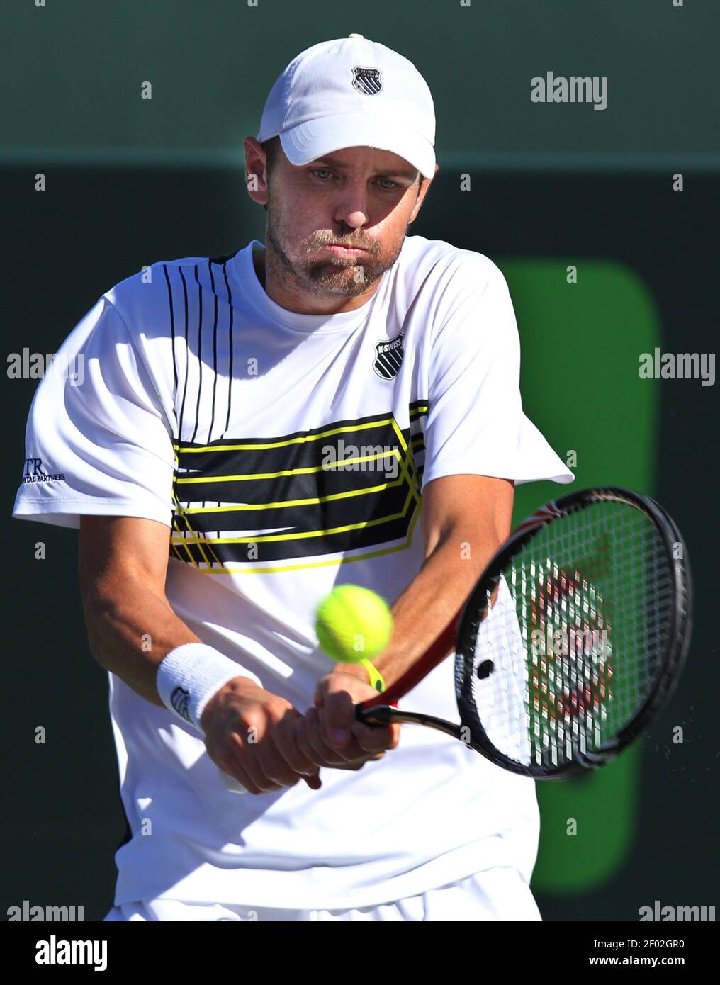 Mardy Fish returns a ball against Juan Monaco during the Sony Ericsson ...