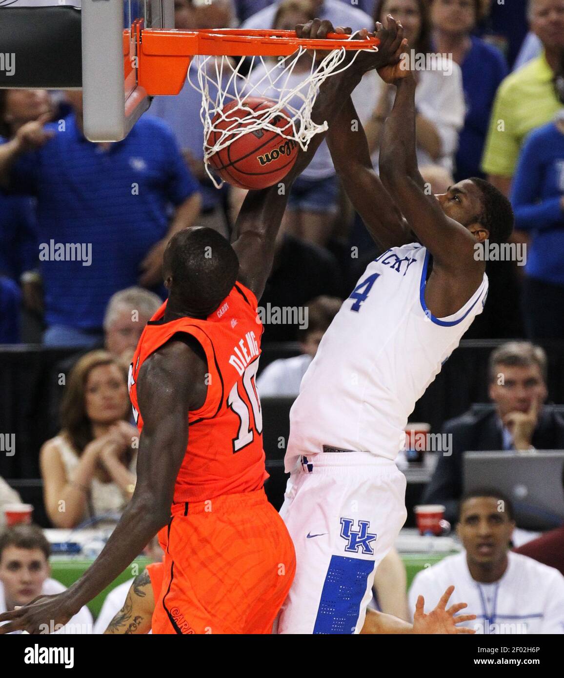 Michael Kidd-Gilchrist (14) of Kentucky puts in a dunk over Gorgui ...