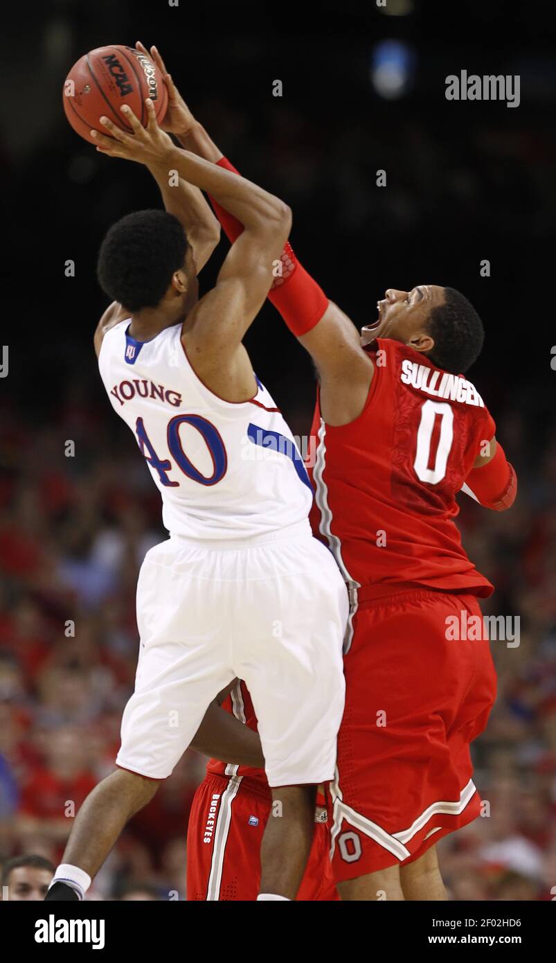 Ohio State's Jared Sullinger (0) blocks a shot by Kansas' Kevin Young ...