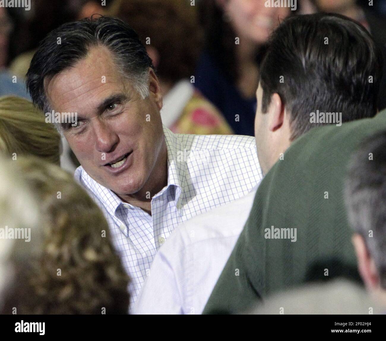 Republican presidential candidate Mitt Romney greets well wishes at the ...