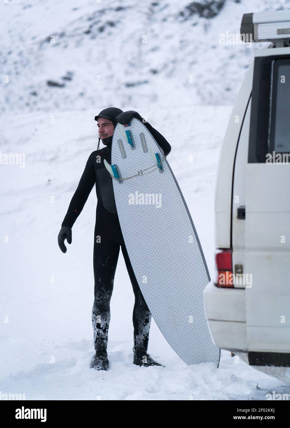 Winter surfer traveling with minivan Stock Photo - Alamy