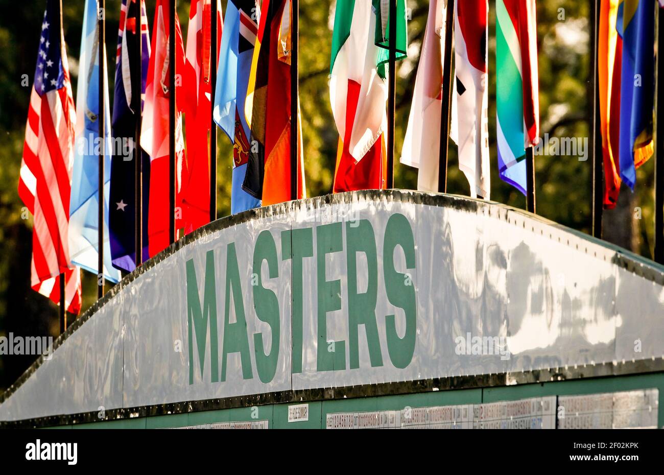 The setting sun illuminates the national flags as the second round of ...