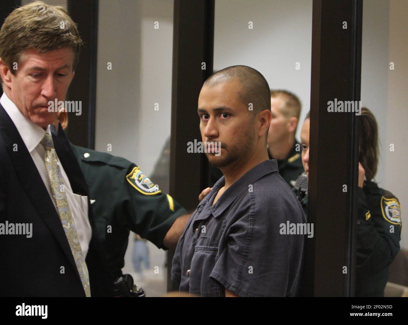 Attorney Mark O'Mara, far left, accompanies his client, George ...