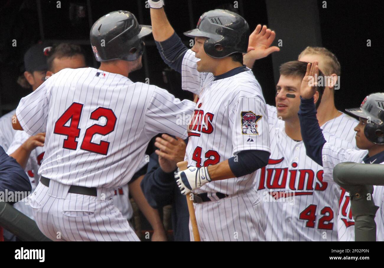 Minnesota Twins teammates congratulated Clete Thomas, left, as he ...