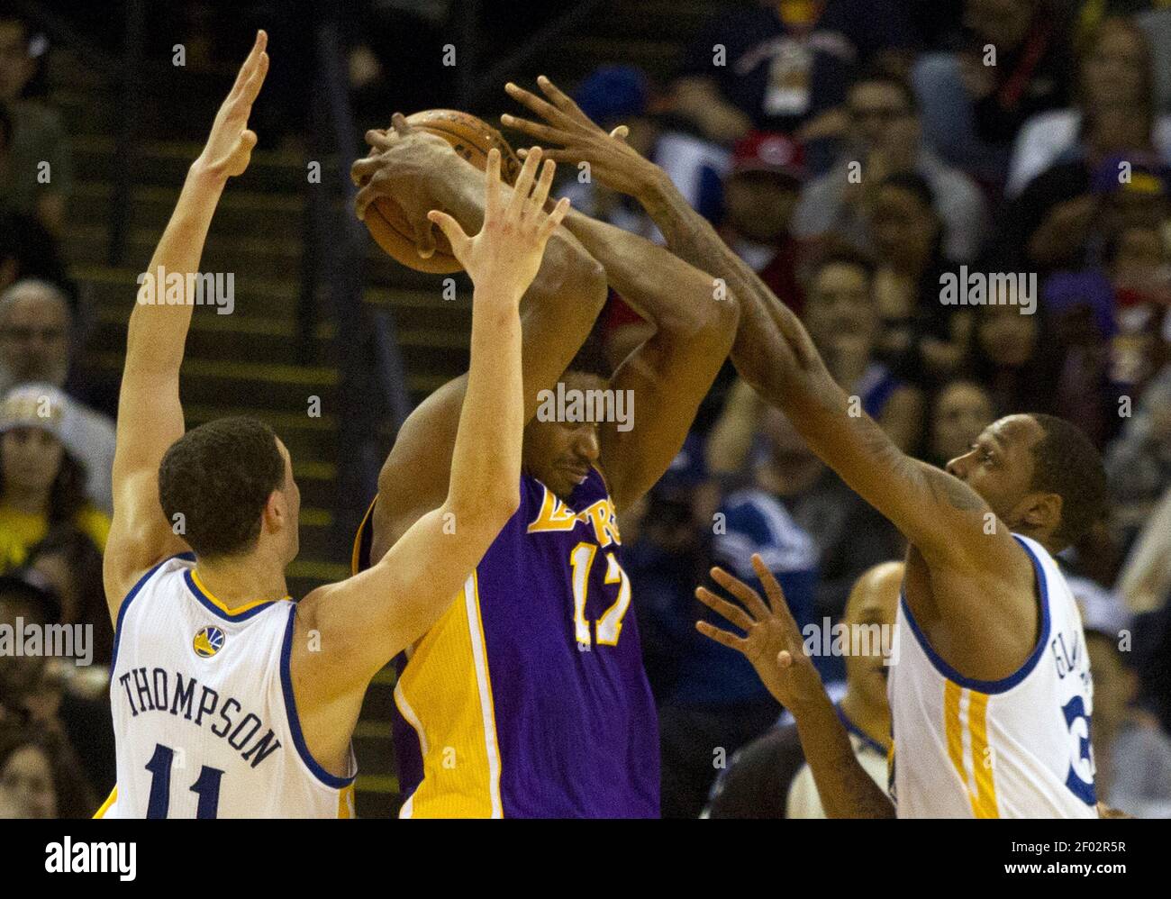 Golden State Warriors defenders Klay Thompson (11) and Mickell Gladness ...