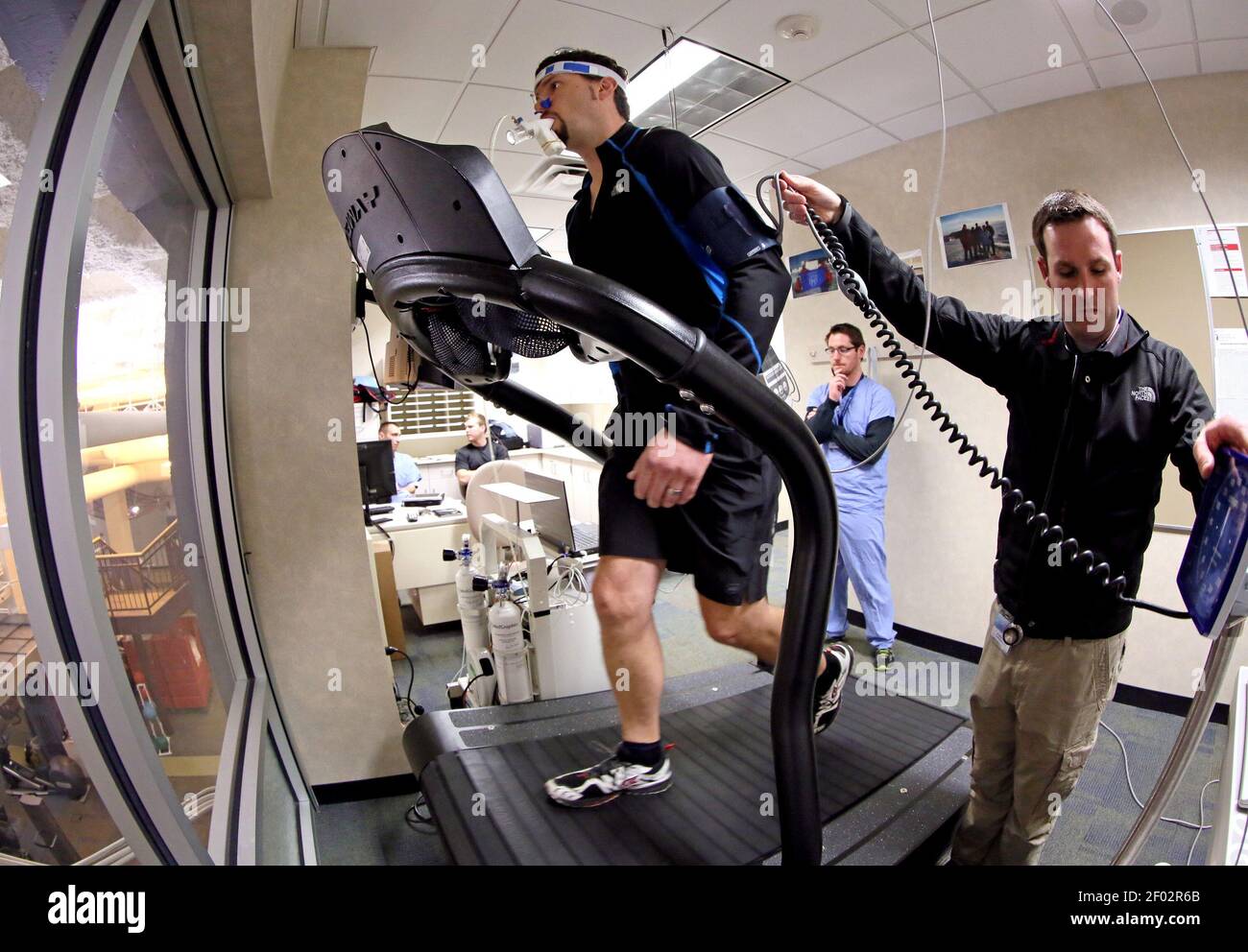 Derek Campbell, left, of North Face, completes a battery of base-line ...