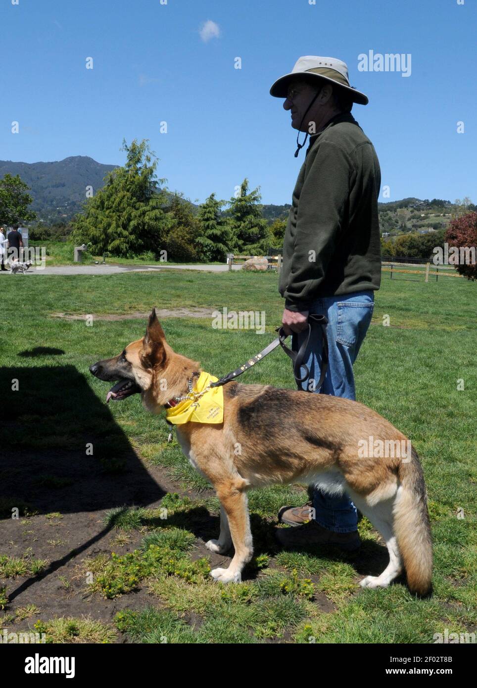 Ralph Kanz, of Oakland, stands with his dog, Travis Ray, during the ...