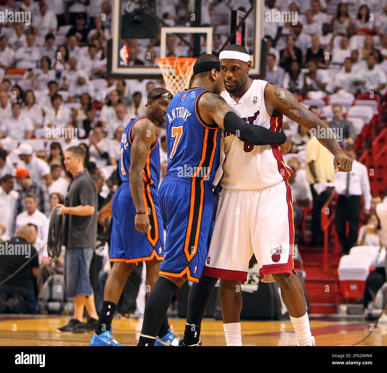 The New York Knicks' Carmelo Anthon, left, hugs the Miami Heat's LeBron ...