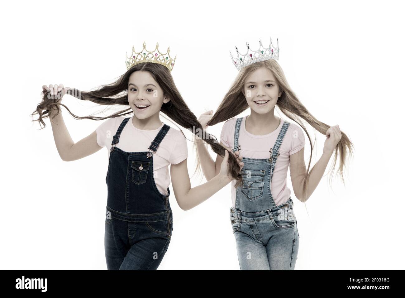 Spoiled children concept. Egocentric princess. Kids wear golden crowns ...