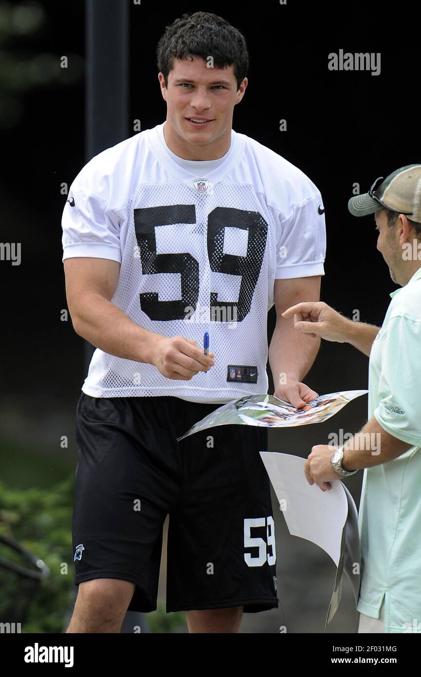 Carolina Panthers rookie linebacker Luke Kuechly signs an autograph for ...