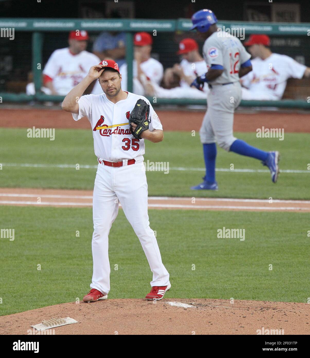 St. Louis Cardinals starting pitcher Jake Westbrook adjusts his cap ...