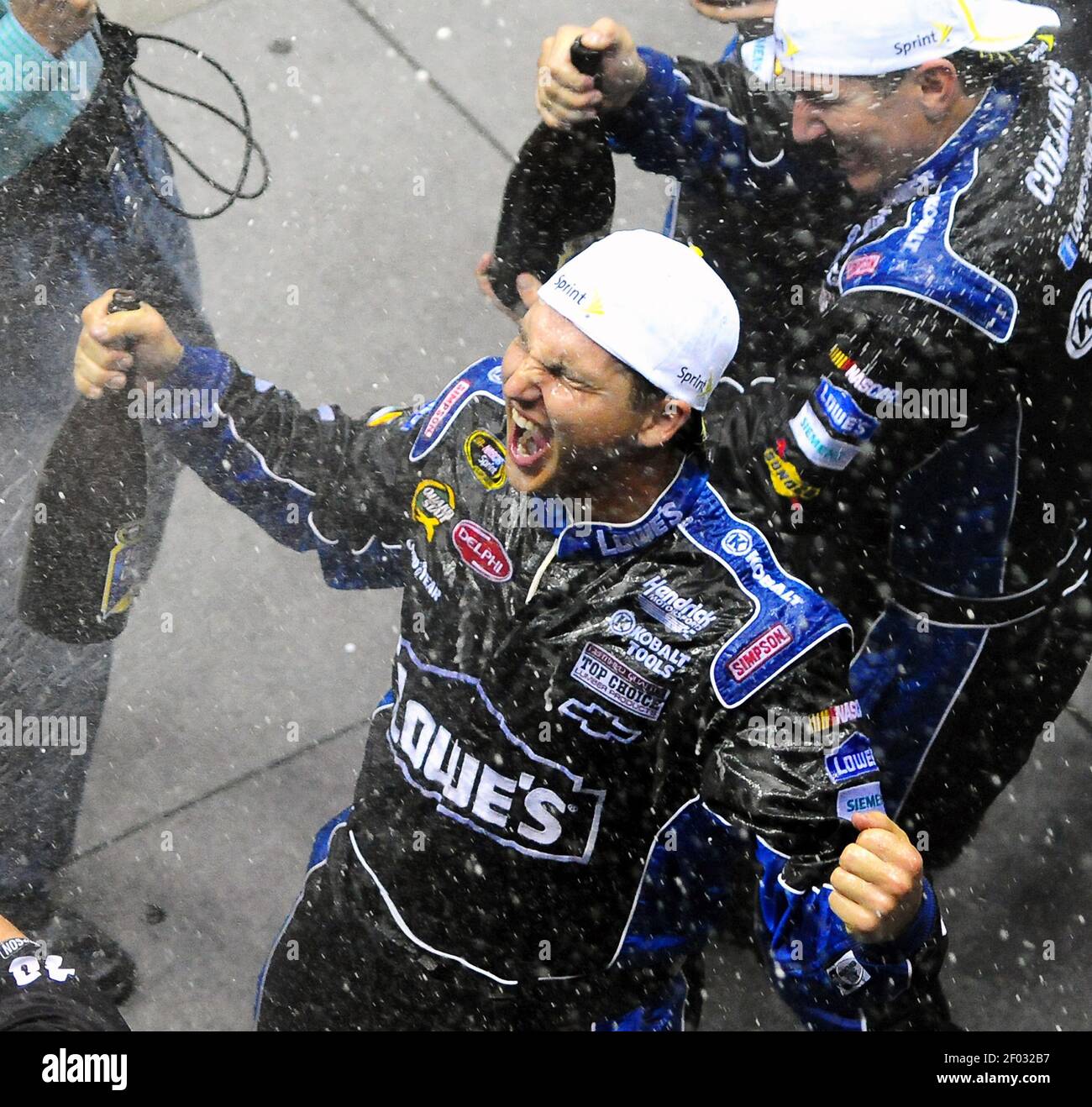 Rear tire carrier Matt Tyrrell celebrates with his My Lowes pit crew ...