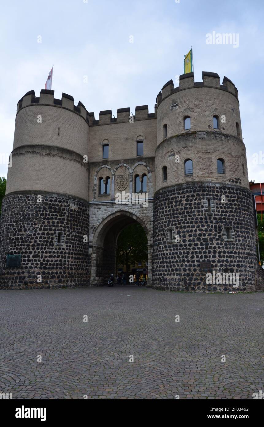 Medieval city gate with two round towers, part of the old city defense ...