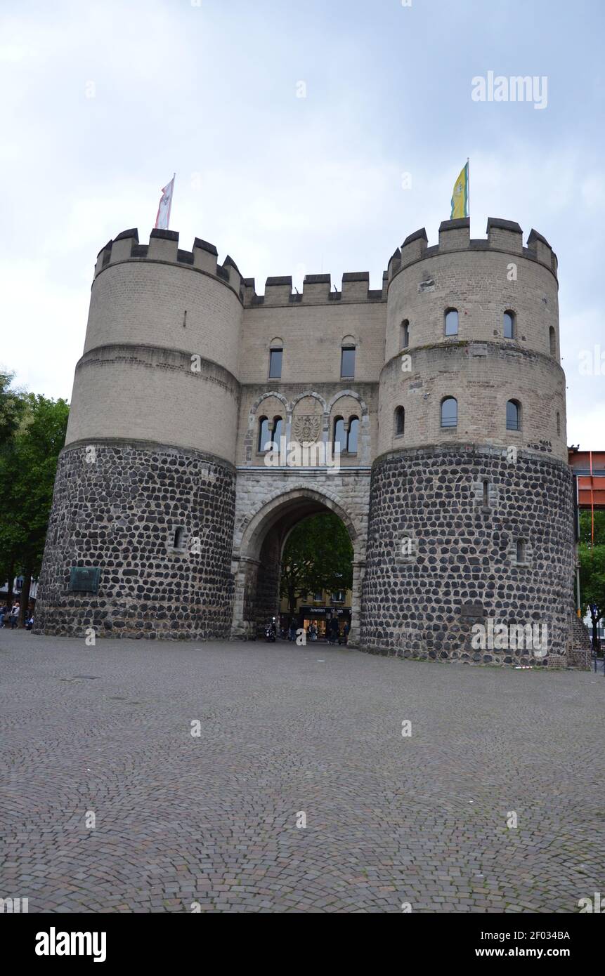 Medieval city gate with two round towers, part of the old city defense ...