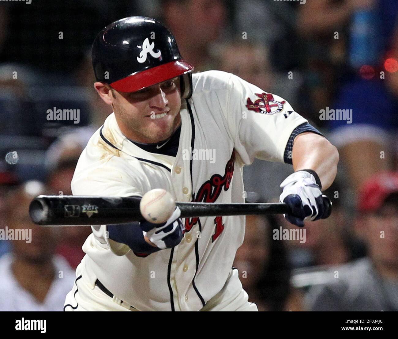 Atlanta Braves Tyler Pastornicky hits a sacrafice bunt to score base ...