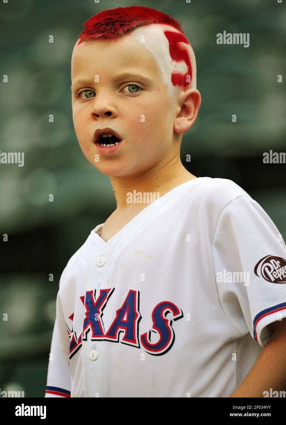 Austin Johnson of Van, Texas, painted the number 5 on his head to honor ...
