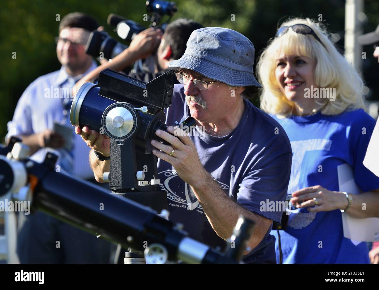 Larry Parmeter of Central Valley Astronomers, adjusts a telescope at ...
