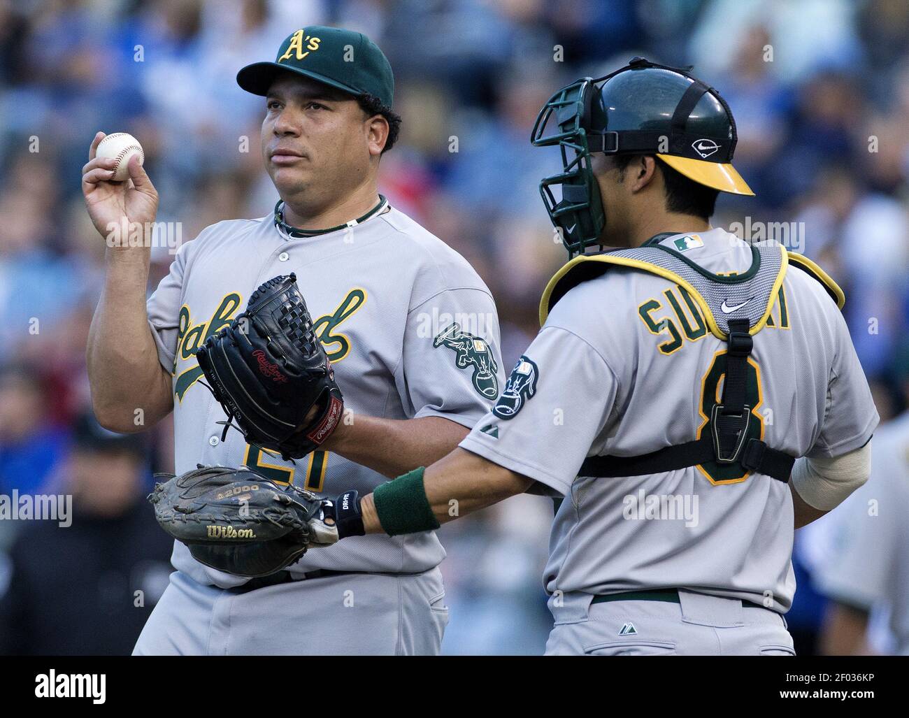 Oakland Athletics starting pitcher Bartolo Colon receives a visit from ...
