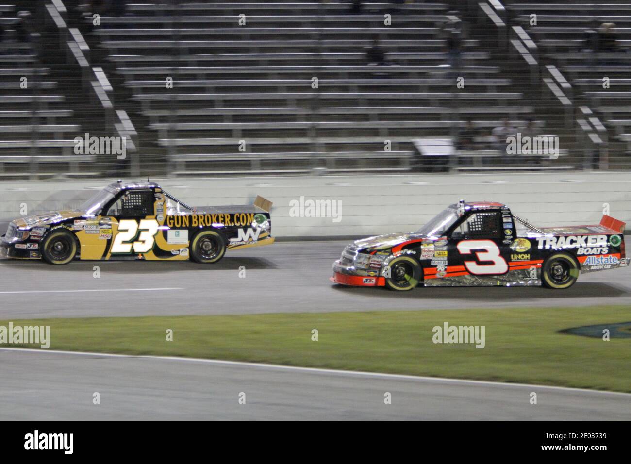 Jason White (23) driving the Gunbroker.com Ford and Ty Dillon (3) in ...