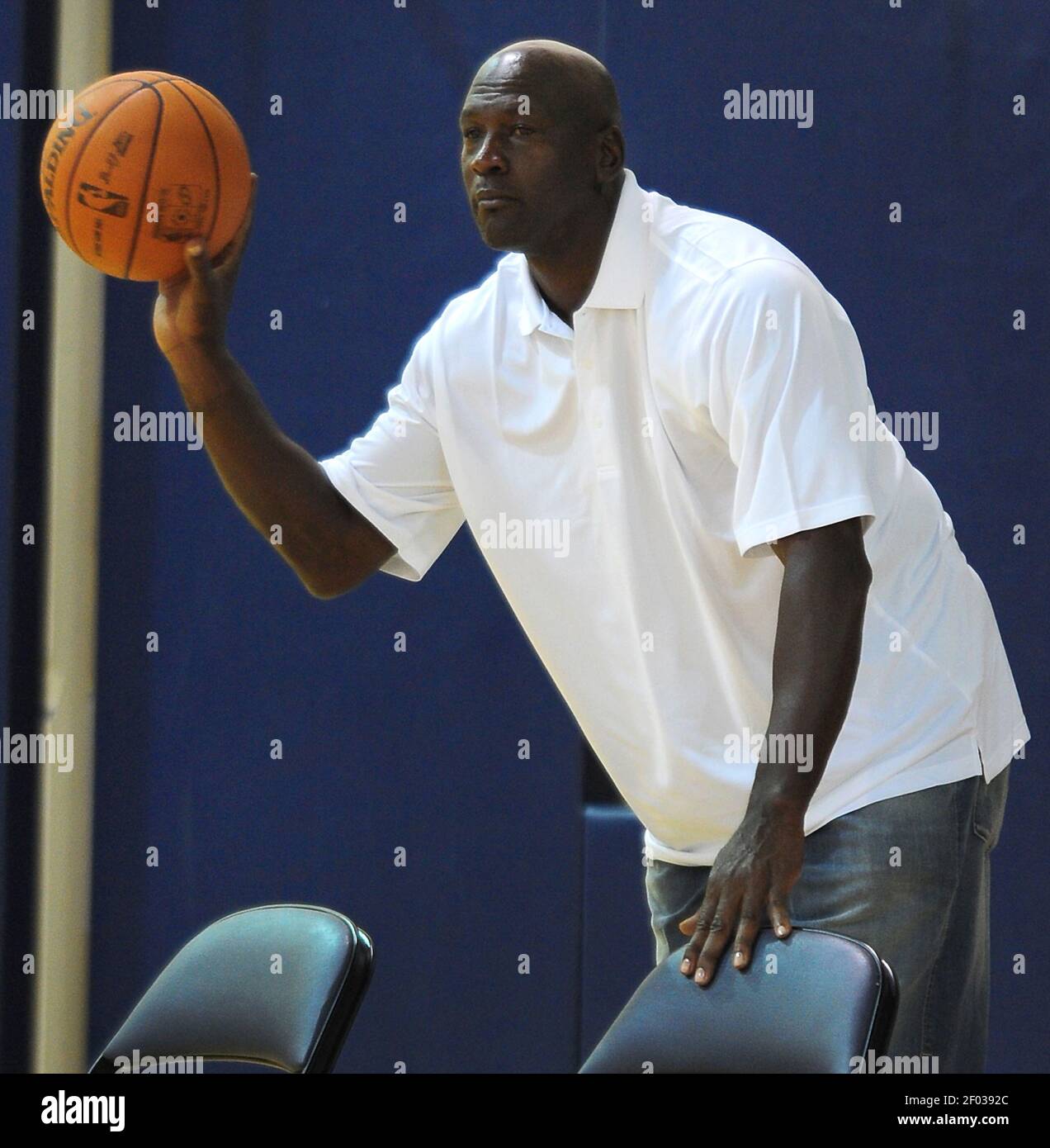 Charlotte Bobcats owner Michael Jordan watches players run through ...