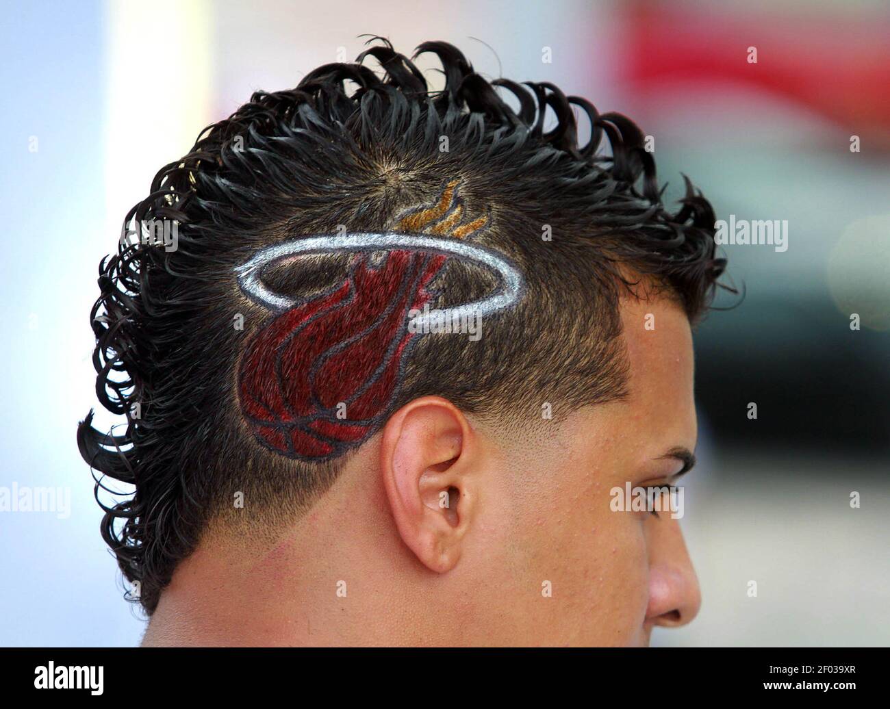 Heat fan Christian Mayans shows off his Miami Heat inspired haircut ...