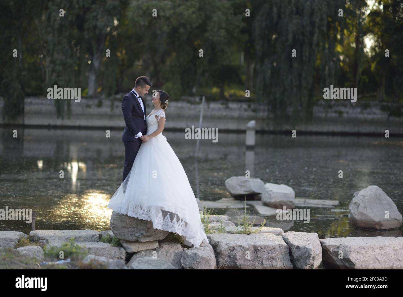 IZMIR, TURKEY - Jul 07, 2017: Young bride and groom outdoors photoshoot ...