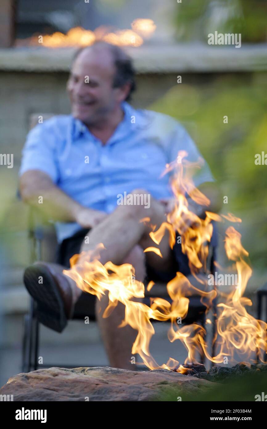 A "fire boulder" burns at the home of Peggy and CraigSchwartz in ...