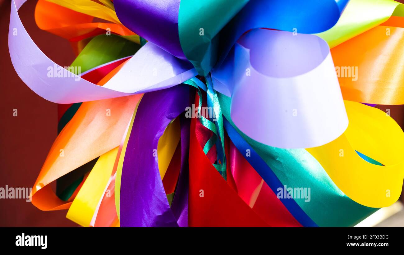 Mass of bright ribbons tied together Stock Photo - Alamy