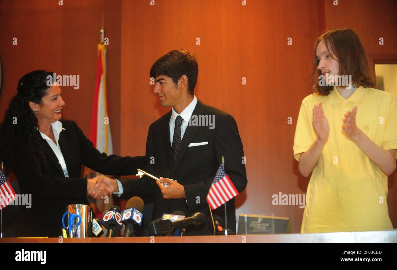 Hallandale Beach Mayor Joy Cooper, left, presents the key to the city ...