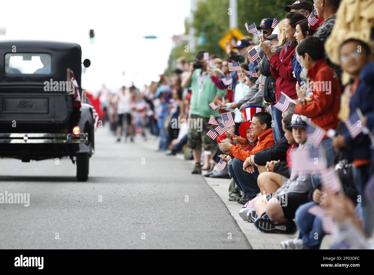 Hundreds of people line the parade route at the Anchorage, Alaska's ...