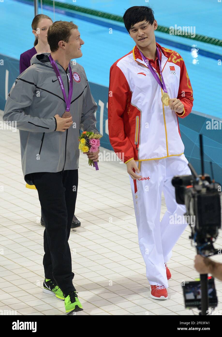 China swimmer and gold medalist Yang Sun, right, chats with USA swimmer ...