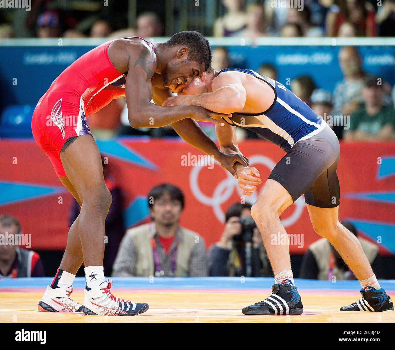 USA's Ellis Coleman (red) wrestles Bulgaria's Ivo Angelov (blue) during ...