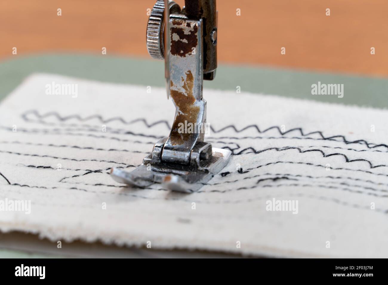 Closeup the sewing machine and item of clothing, old sewing machine ...