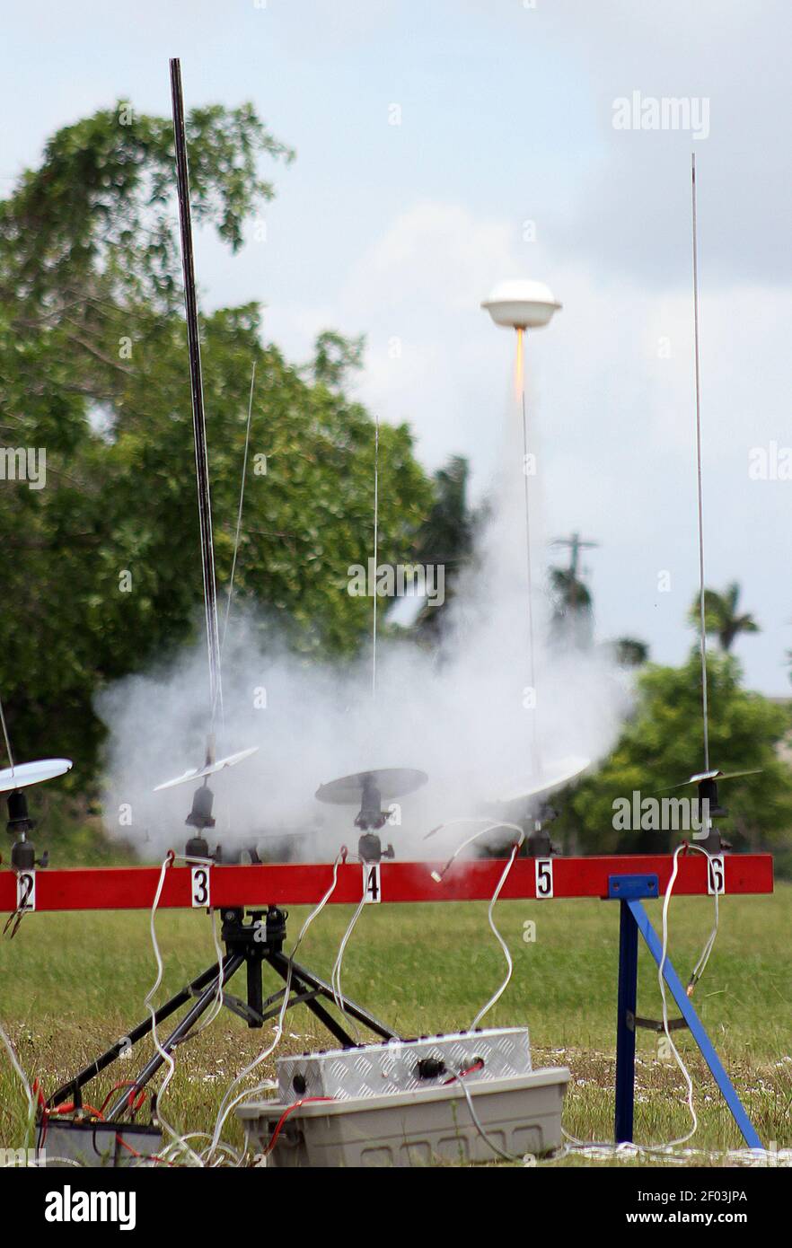A model rocket shaped like a flying saucer is launched during The ...