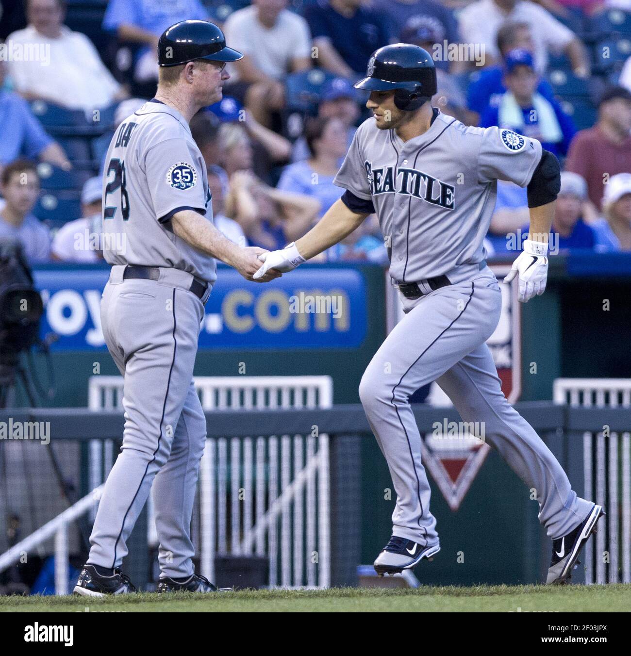 Seattle Mariners' Casper Wells (33) is congratulated by third base ...