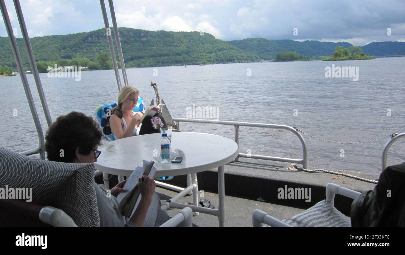 Passing a lazy afternoon on a houseboat on the Mississippi River ...